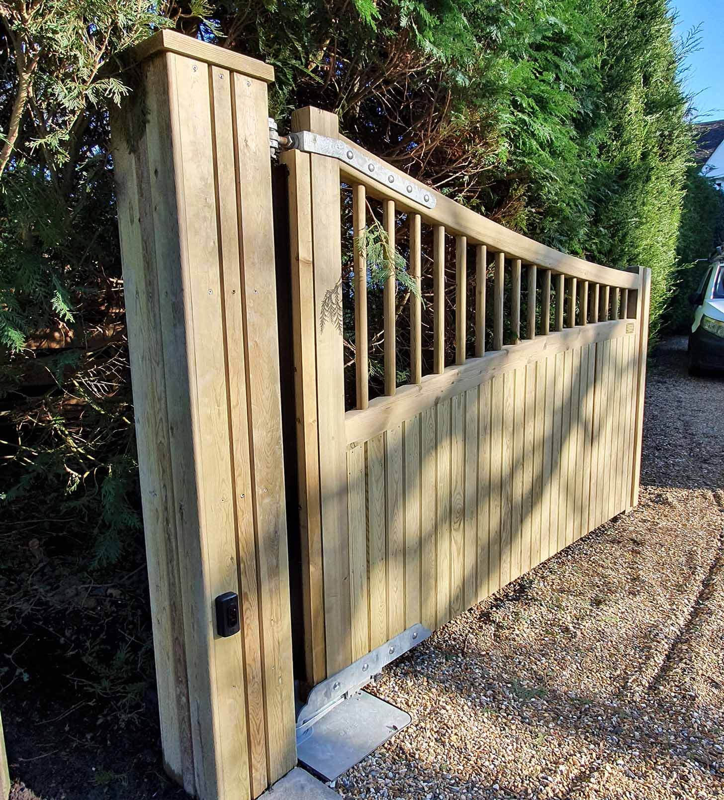 Custom wooden driveway gates bring garden to life | Jacksons Fencing